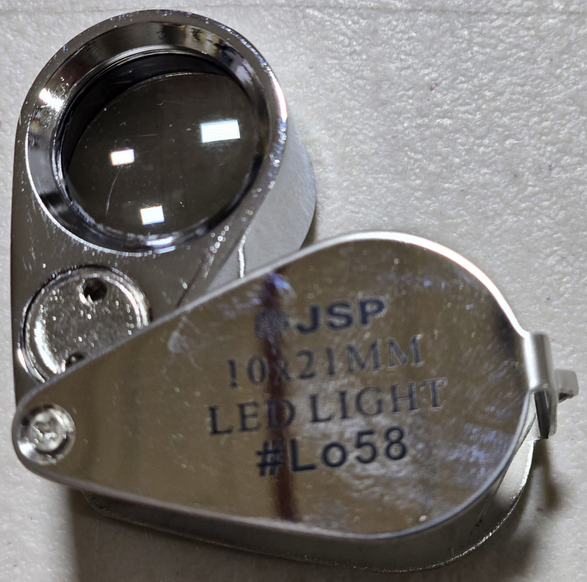 L058 – 10X 21mm Lighted LED Loupe — Coin & Stamp Supplies